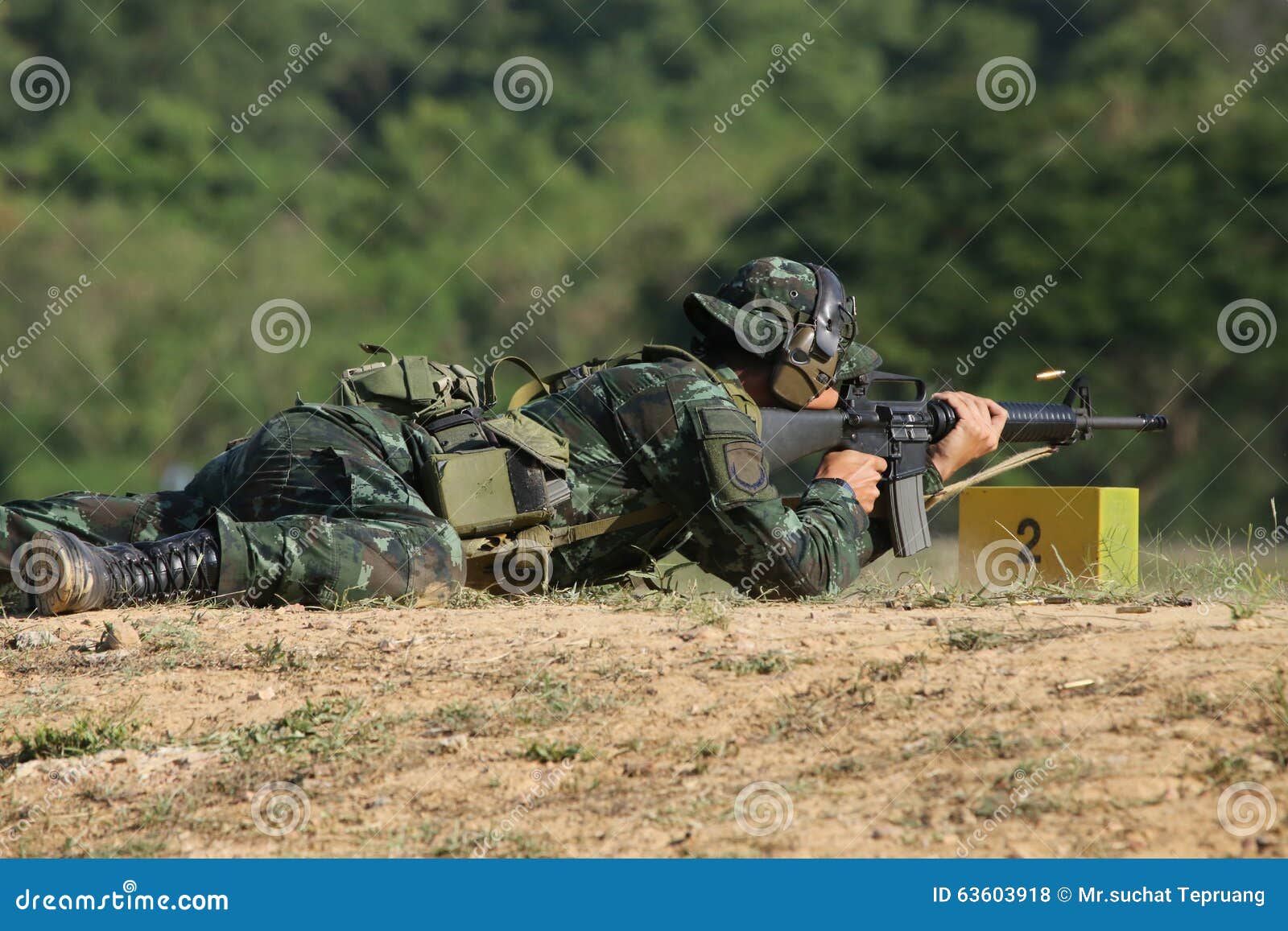 Soldier is shooting rifle stock photo. Image of defense - 63603918