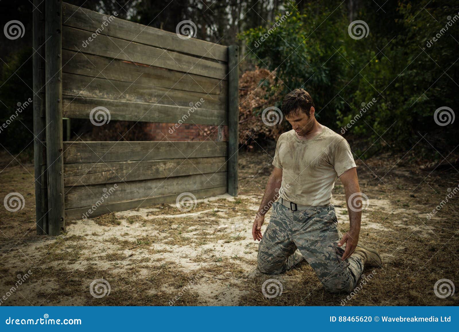 Soldier Sitting on His Knees Stock Photo - Image of attractive, camp ...