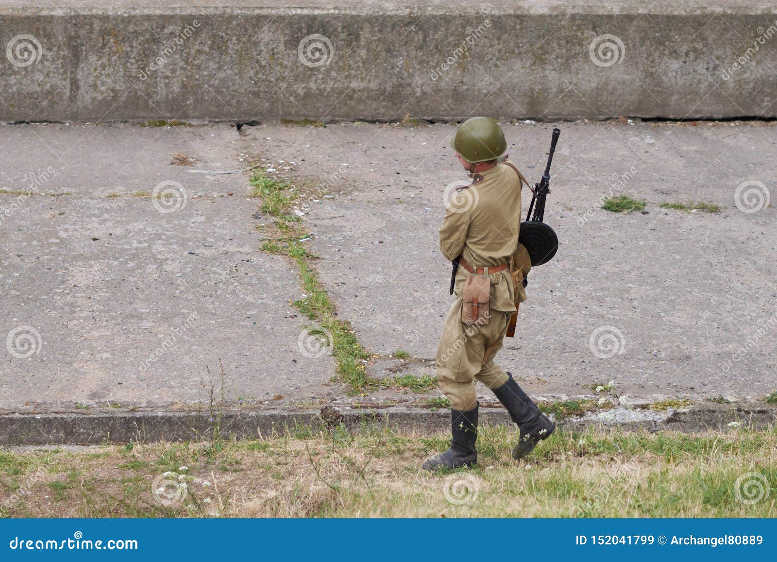 A Soldier in Soviet Uniform, with an Assault Rifle, from the Back ...