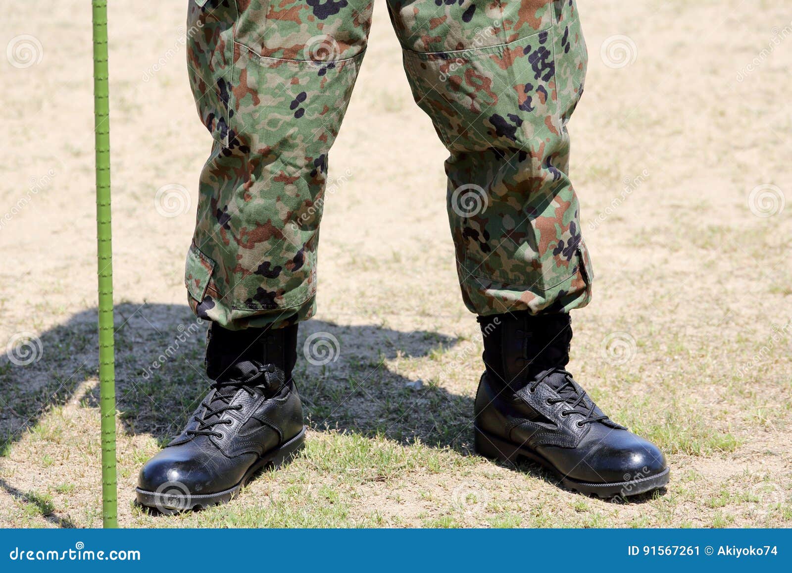 Soldier Standing with Boots Stock Image - Image of artillery, footwear ...