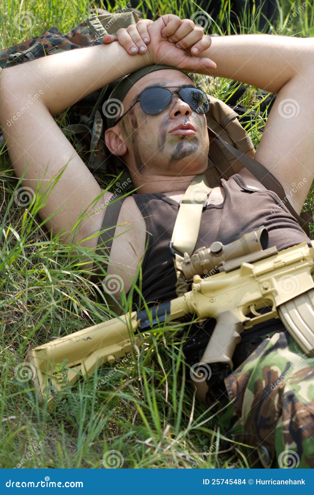 Soldier Takes Rest Lying on a Grass Stock Photo - Image of paint, rifle ...