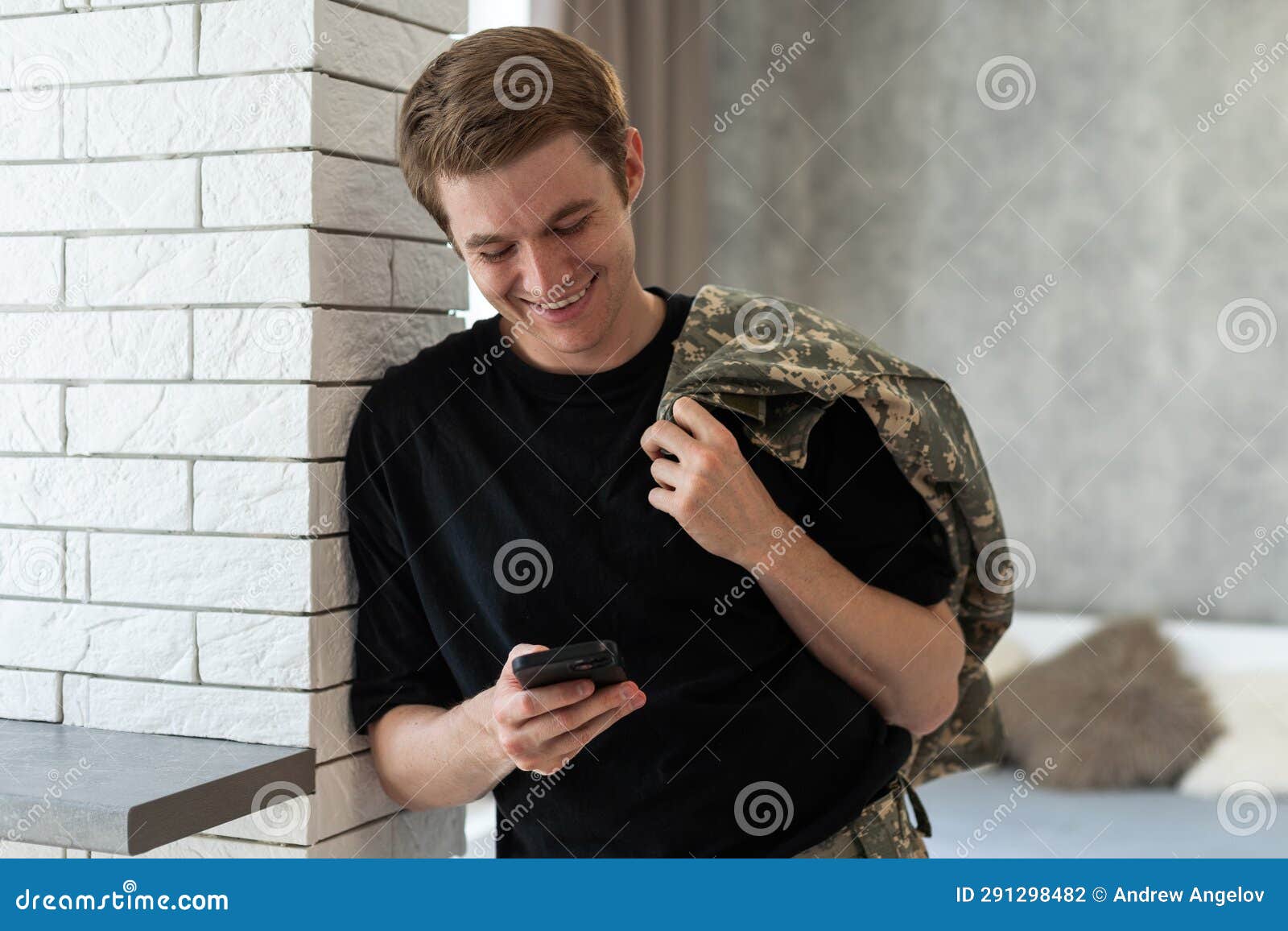 Soldier Talking by Mobile Phone at Home. Stock Photo - Image of ...