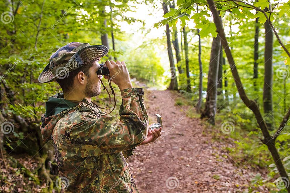 Soldier Using Binoculars and Compass in Forest Stock Image - Image of ...