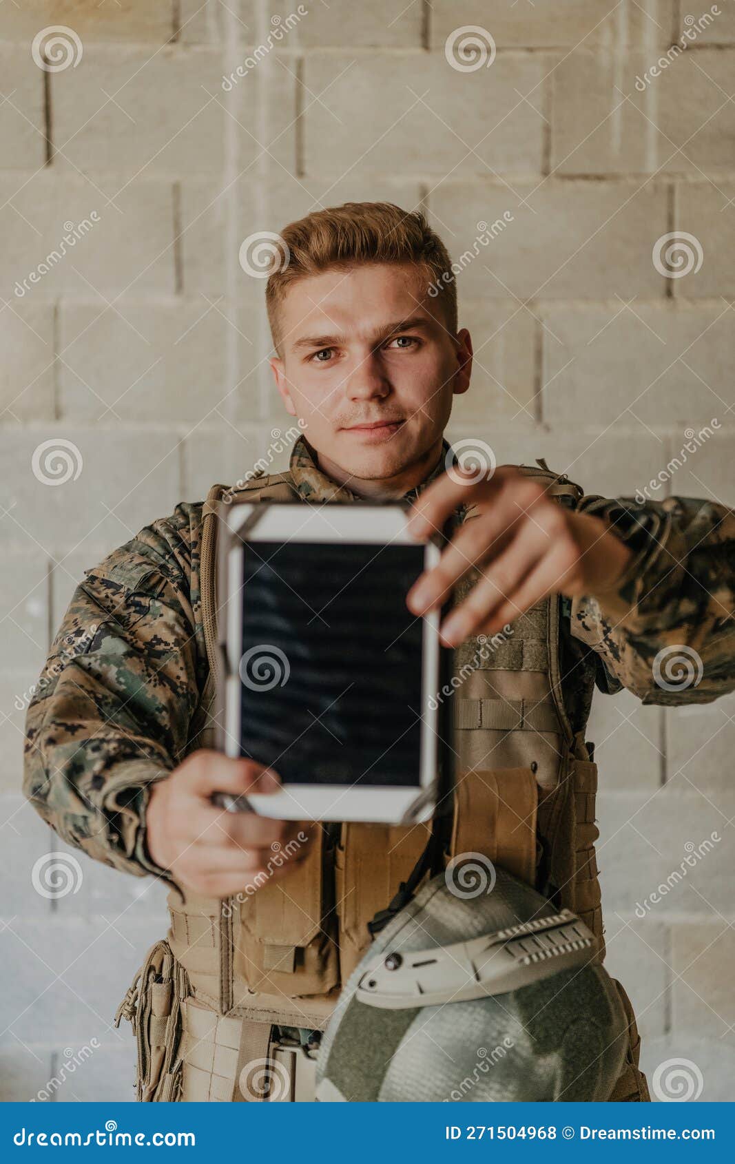 Soldier Using Tablet Computer Against Old Brick Wall Stock Photo ...