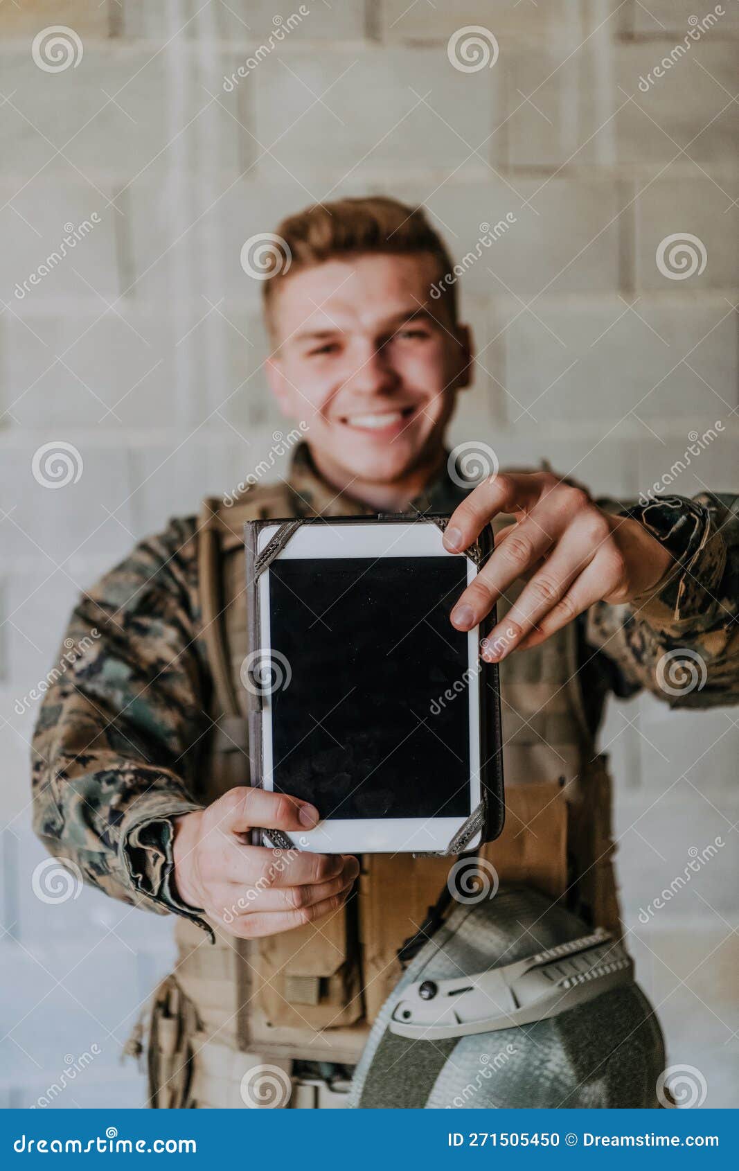 Soldier Using Tablet Computer Against Old Brick Wall Stock Photo ...