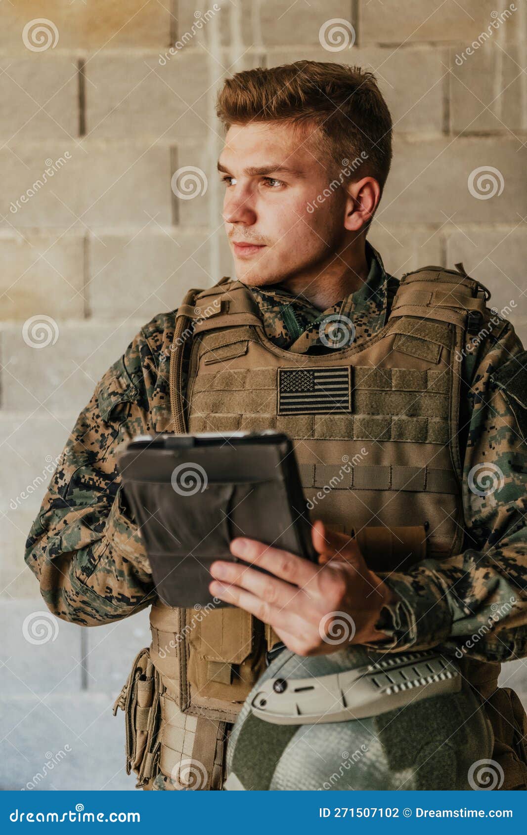 Soldier Using Tablet Computer Against Old Brick Wall Stock Photo ...