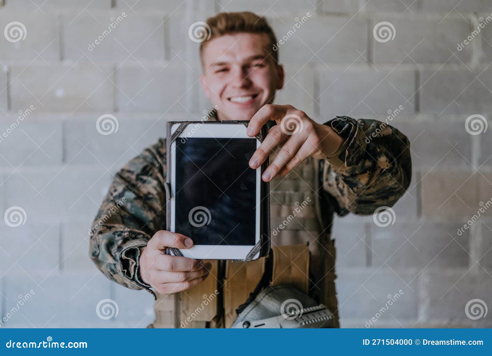 Soldier Using Tablet Computer Against Old Brick Wall Stock Photo ...