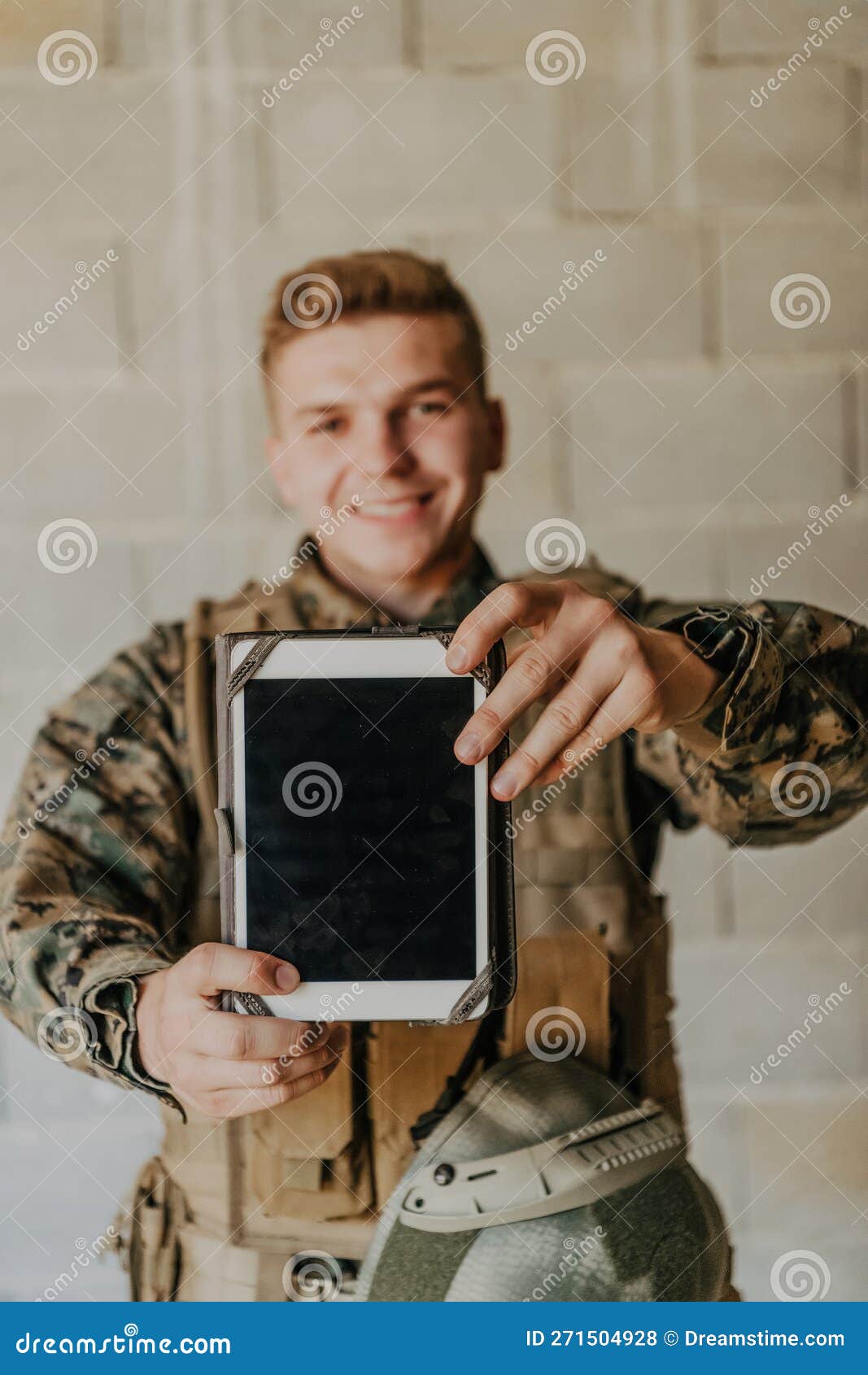 Soldier Using Tablet Computer Against Old Brick Wall Stock Photo ...