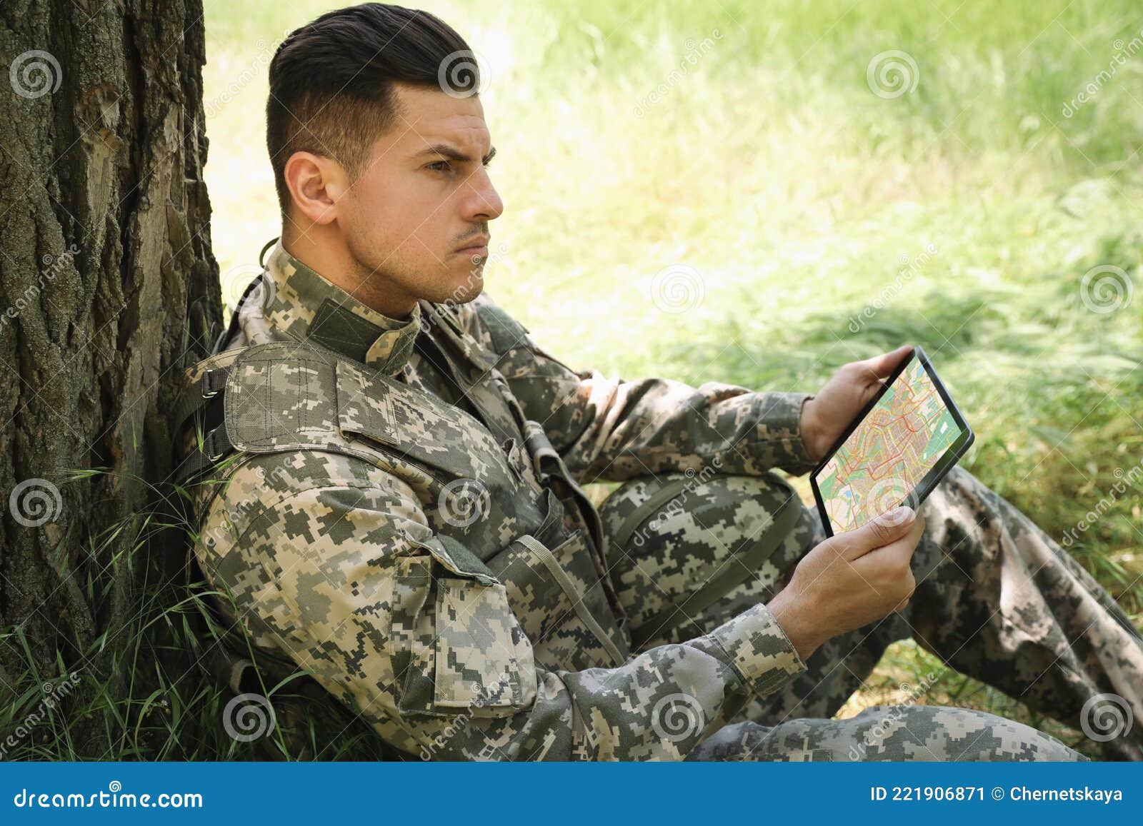 Soldier Using Tablet Near Tree in Forest Stock Image - Image of sitting ...