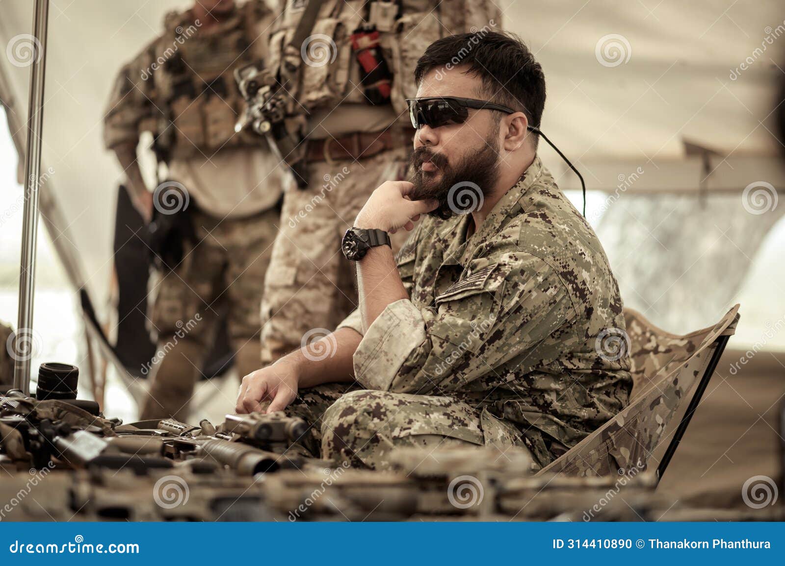 Soldiers in Camouflage Uniforms Planning on Operation in the Camp ...