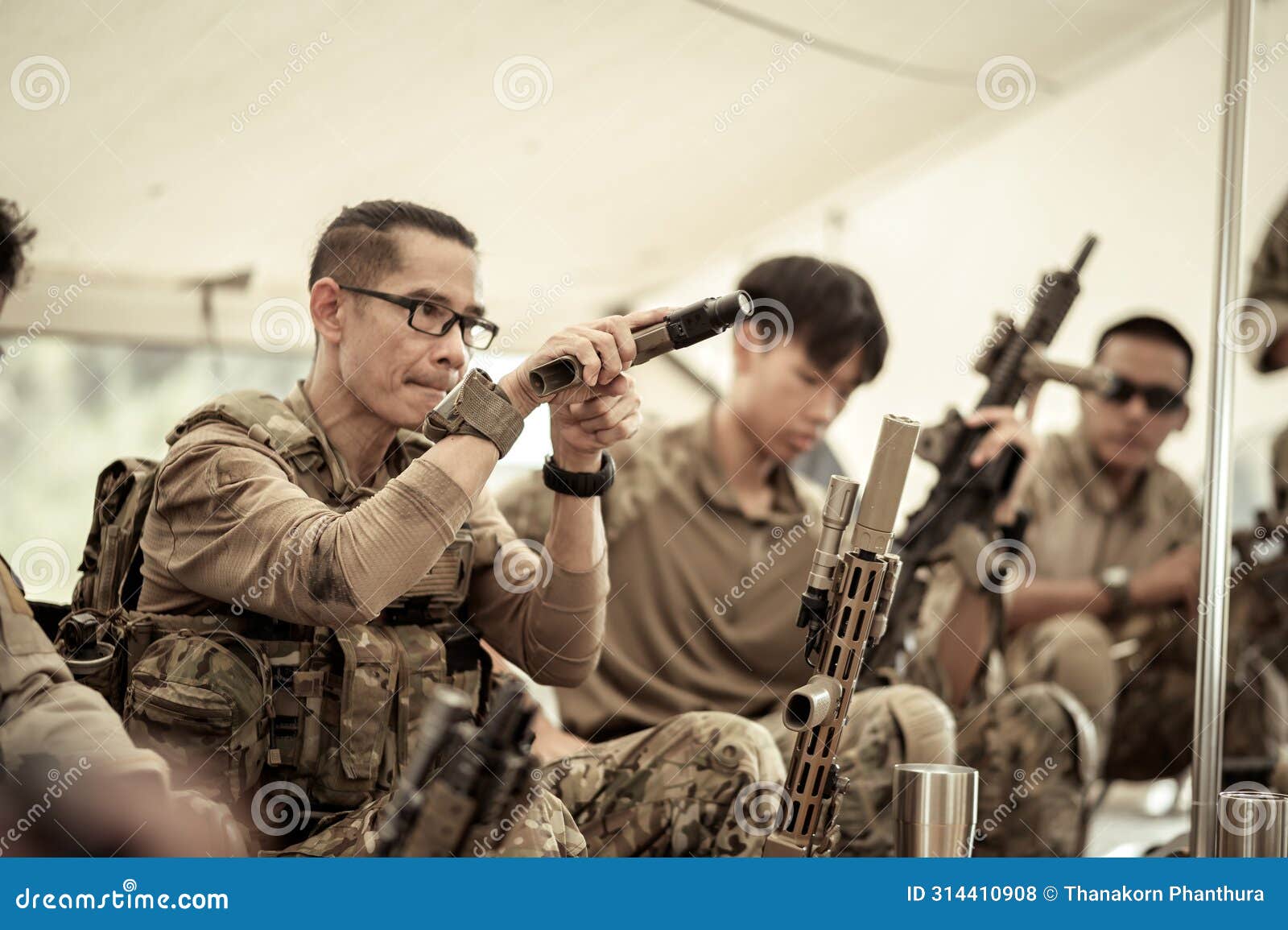 Soldiers in Camouflage Uniforms Planning on Operation in the Camp ...
