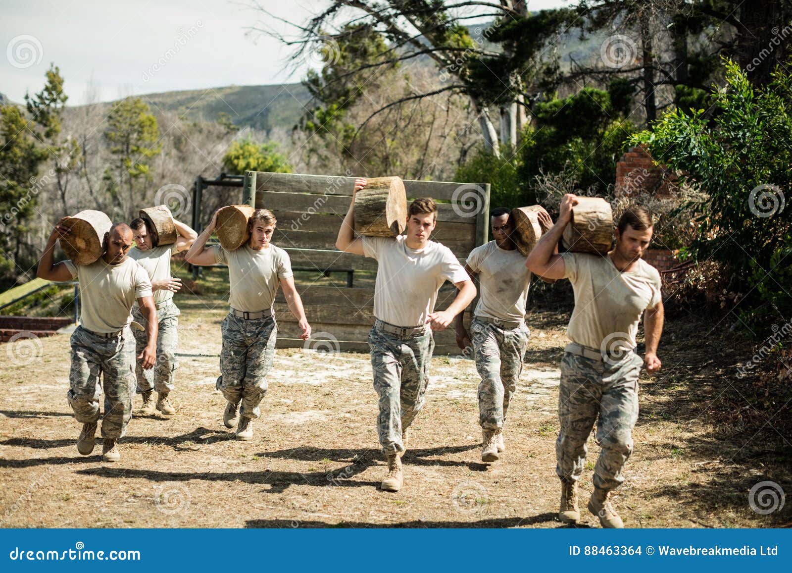Soldiers Carrying a Tree Log Stock Photo - Image of caucasian, ground ...