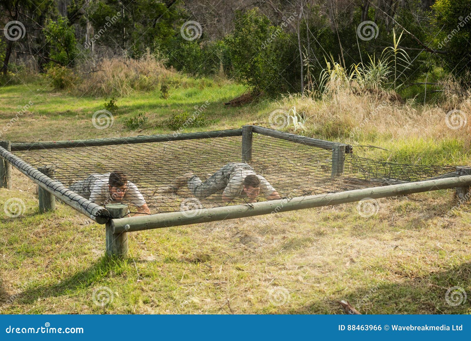 Soldiers Crawling Under the Net during Obstacle Course Stock Photo ...