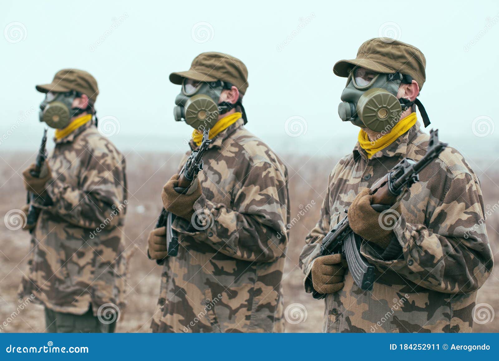 Soldiers with Gas Mask and Automatic Guns Standing Ready Stock Image ...