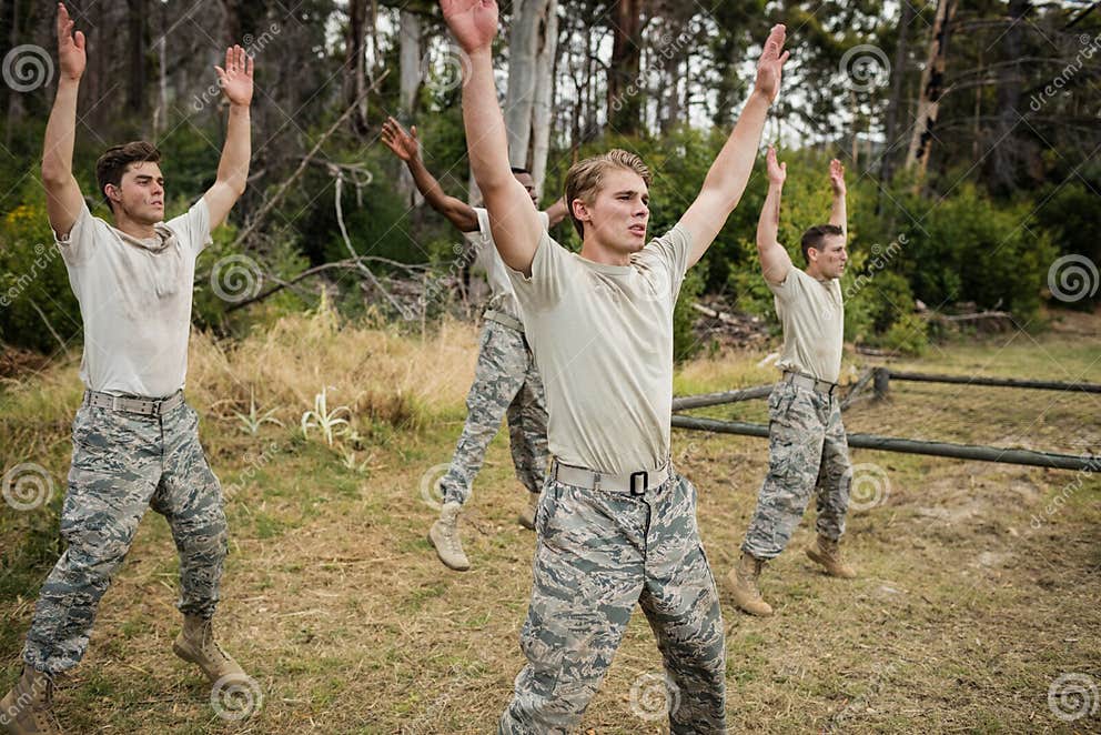 Soldiers Performing Stretching Exercise Stock Photo - Image of power ...