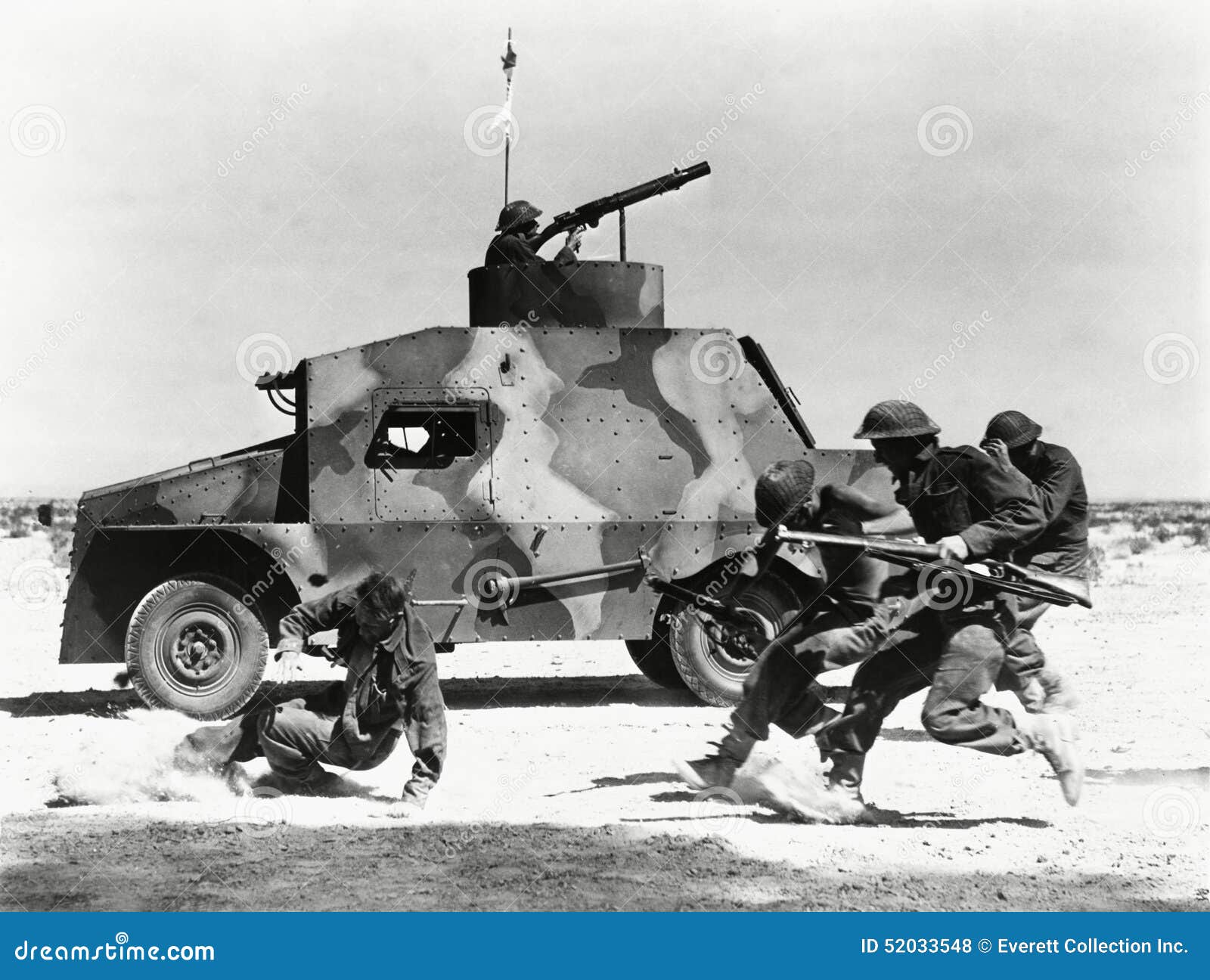 Soldiers Running Along Side of Tank in the Desert Stock Photo - Image ...