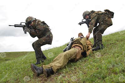 Soldiers Saving Their Wounded Partner Stock Image - Image of help ...
