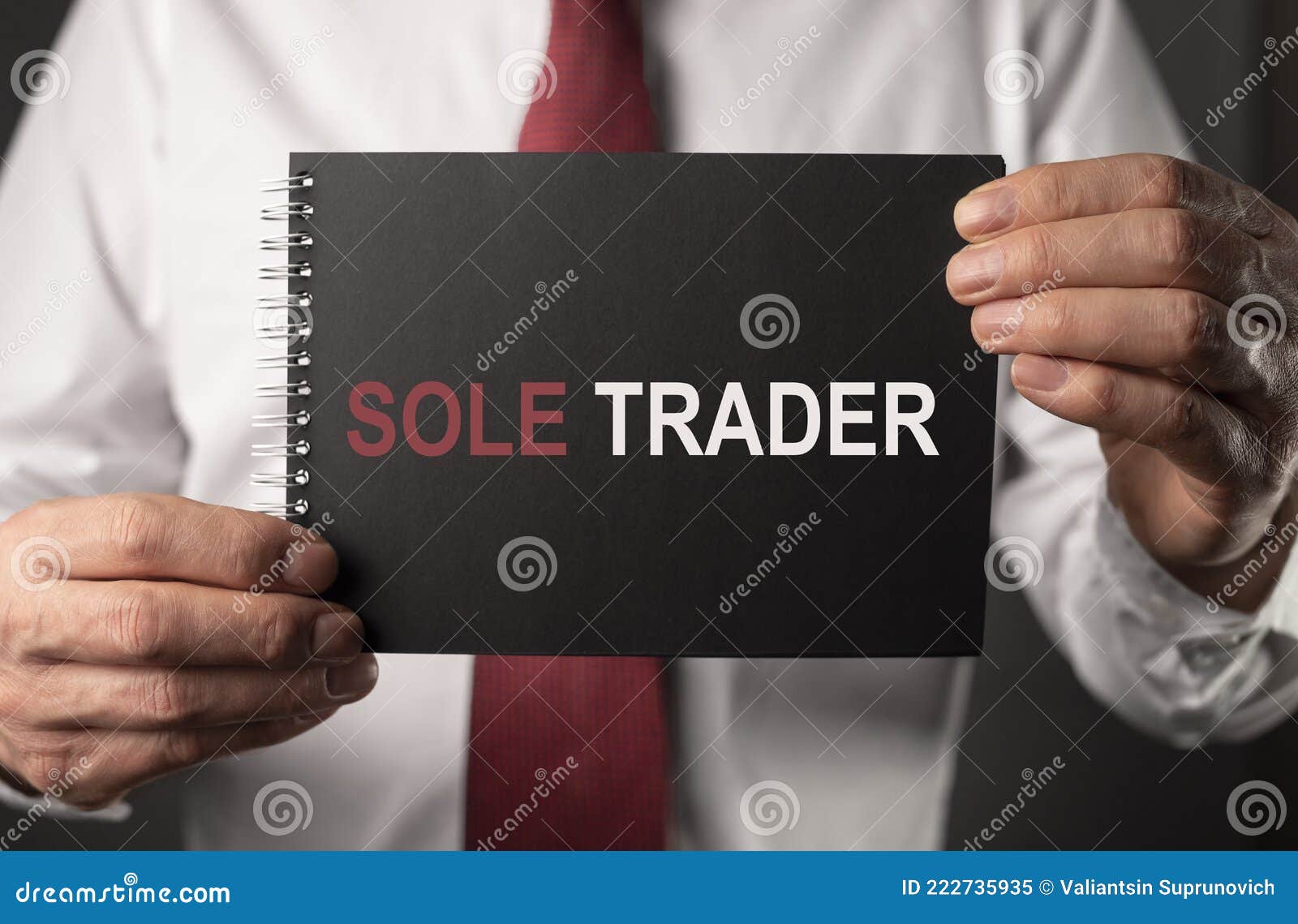 SOLE TRADER TEXT on NOTE in HAND of BUSINESSMAN Stock Image - Image of ...