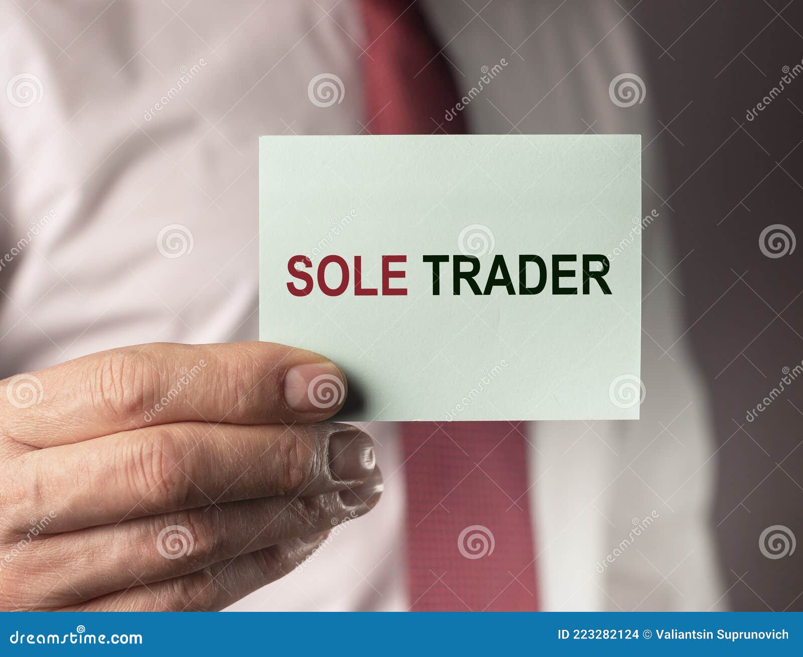 SOLE TRADER TEXT on NOTE in HAND of BUSINESSMAN Stock Photo - Image of ...