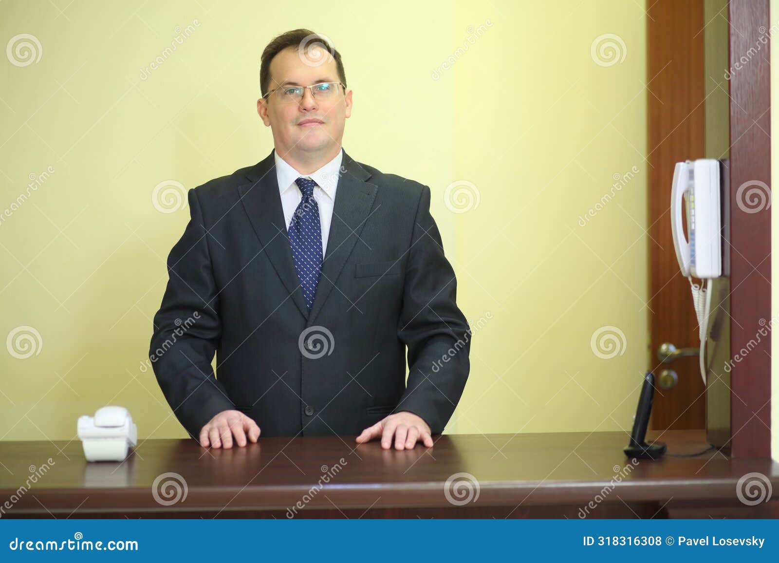 Solid Concierge Behind the Counter at His Stock Photo - Image of ...