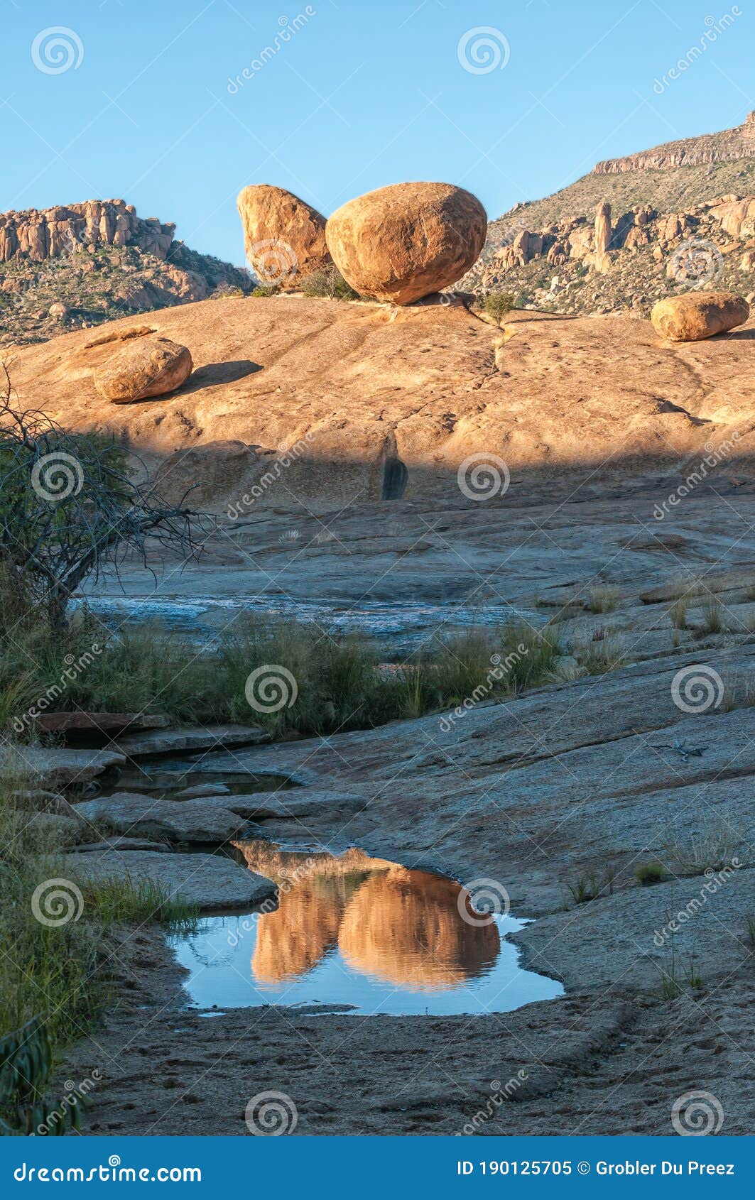 Solid Granite Boulders with Reflections in a Pool Stock Image - Image ...