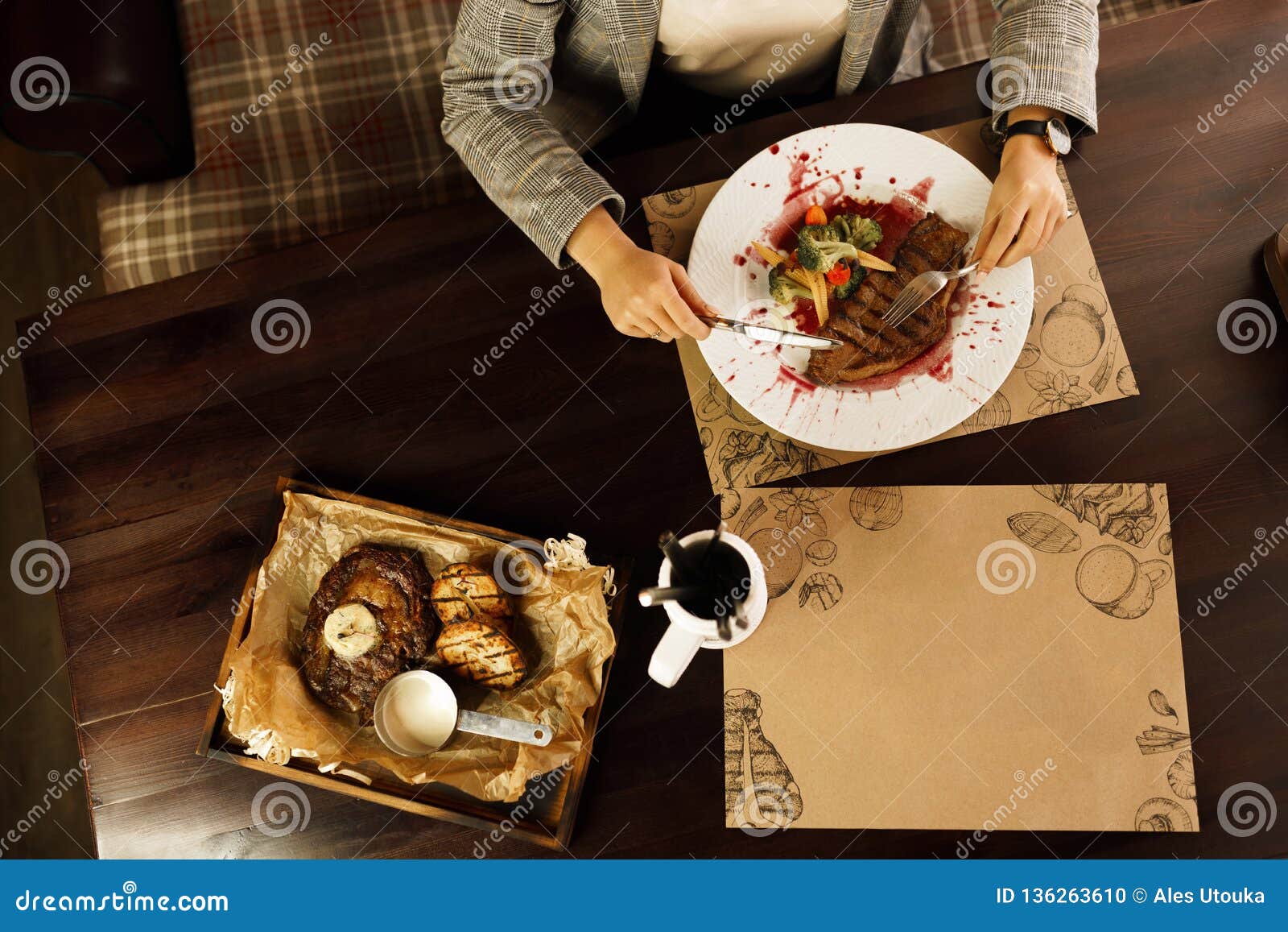 A Solid Lady Sits at a Table in a Luxurious Restaurant Stock Photo ...