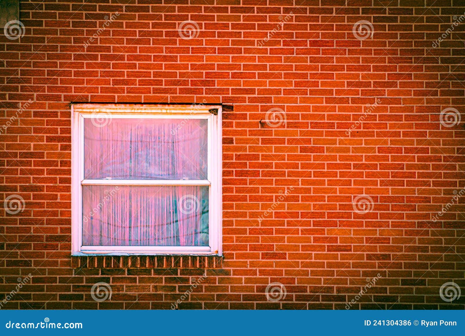 A Solid Red Brick Wall with a Single Glass-paned Window in Orwell, Ohio ...