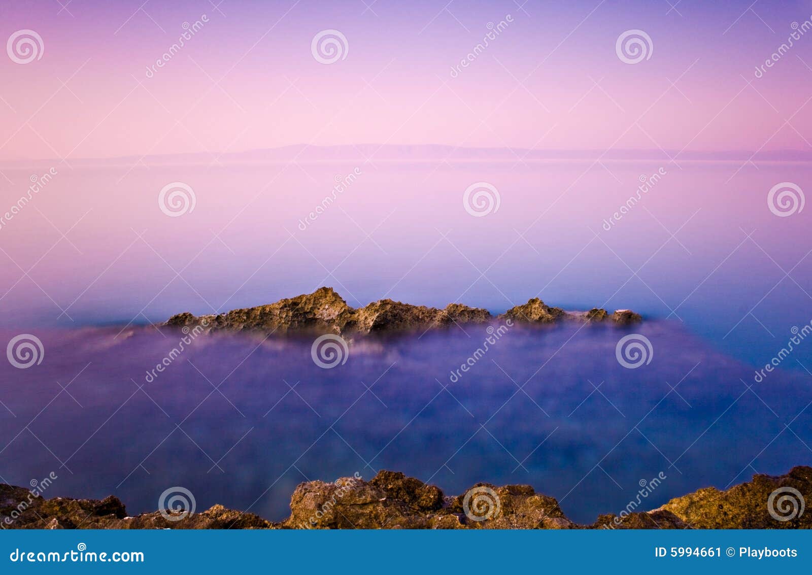 Solid Rock and a Beautiful Ocean at Dusk Stock Image - Image of ...