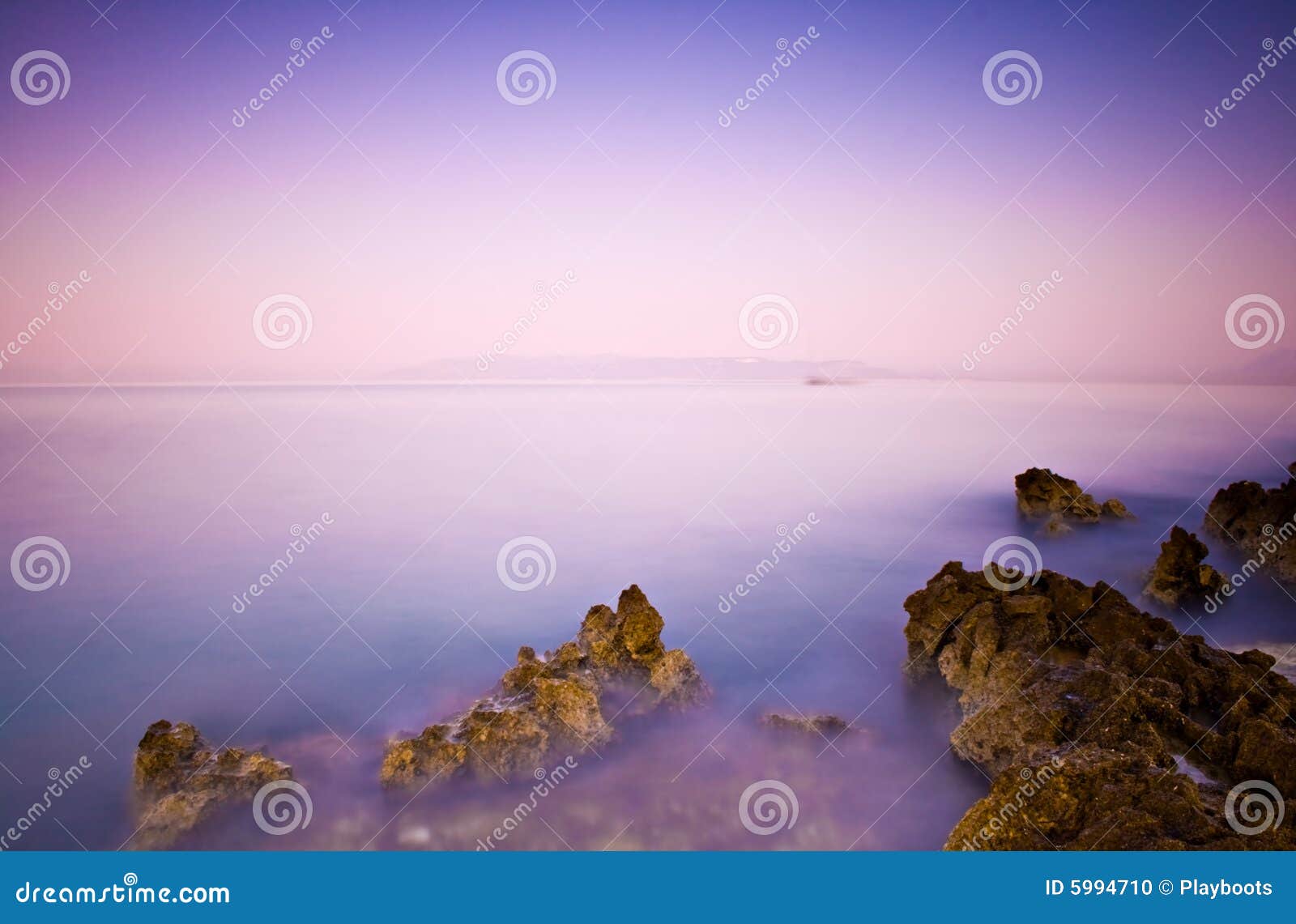 Solid Rocks and a Beautiful Ocean at Dusk Stock Photo - Image of cloud ...