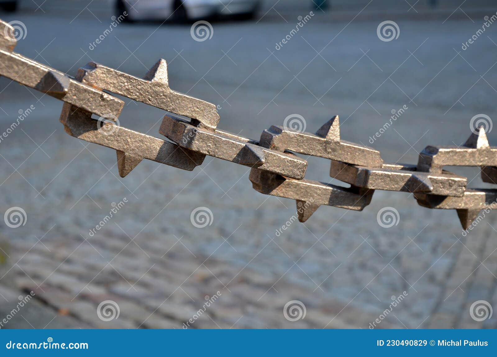 Solid Steel Chain with Rectangular Mesh. There is a Steel Spike on Each ...