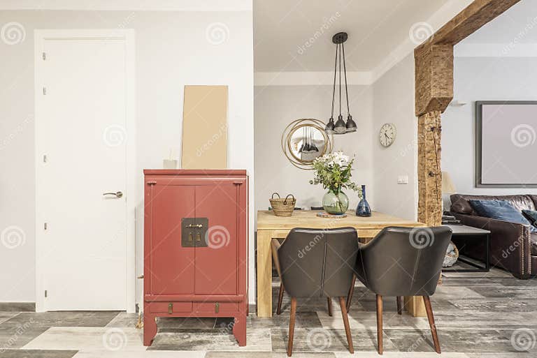 Solid Wood Dining Table Next To a Red Asian Style Sideboard in a Room ...