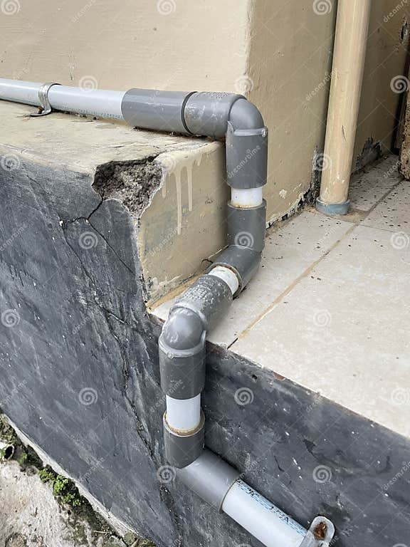 Water Pipe Connection in the Corner of the Building Stock Image - Image ...