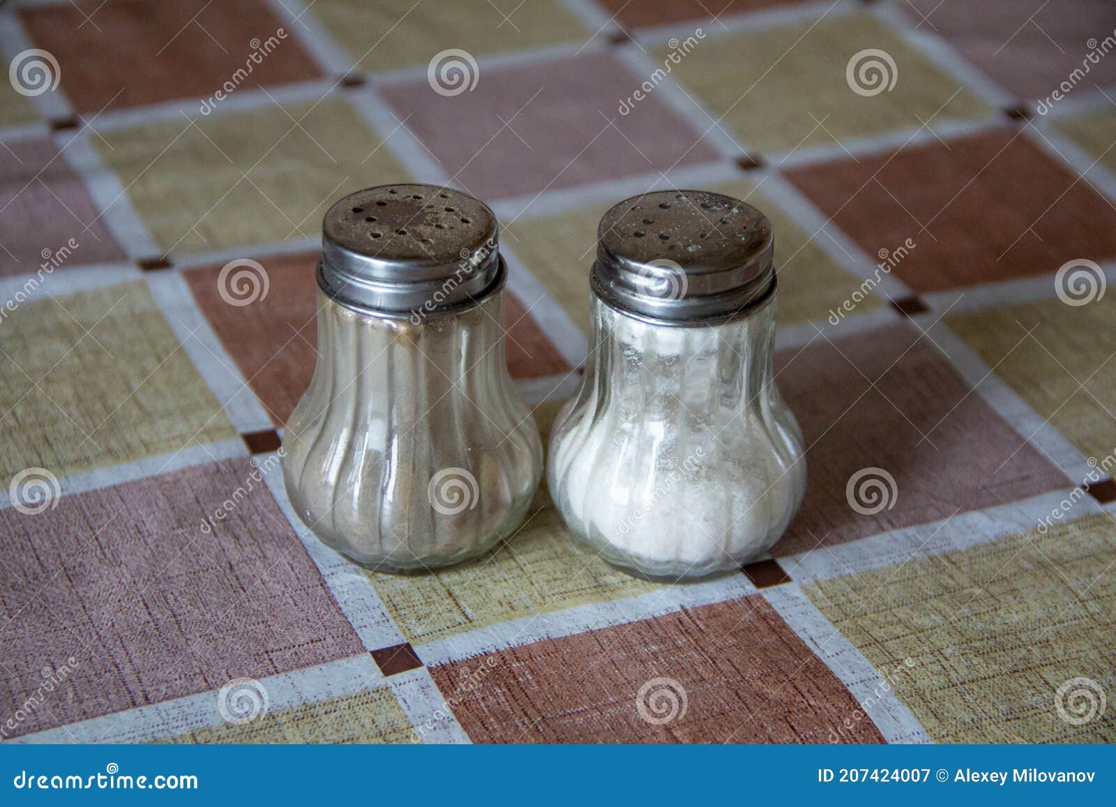 Solt and Paper Shakers on a Table, Isolated Stock Image - Image of ...
