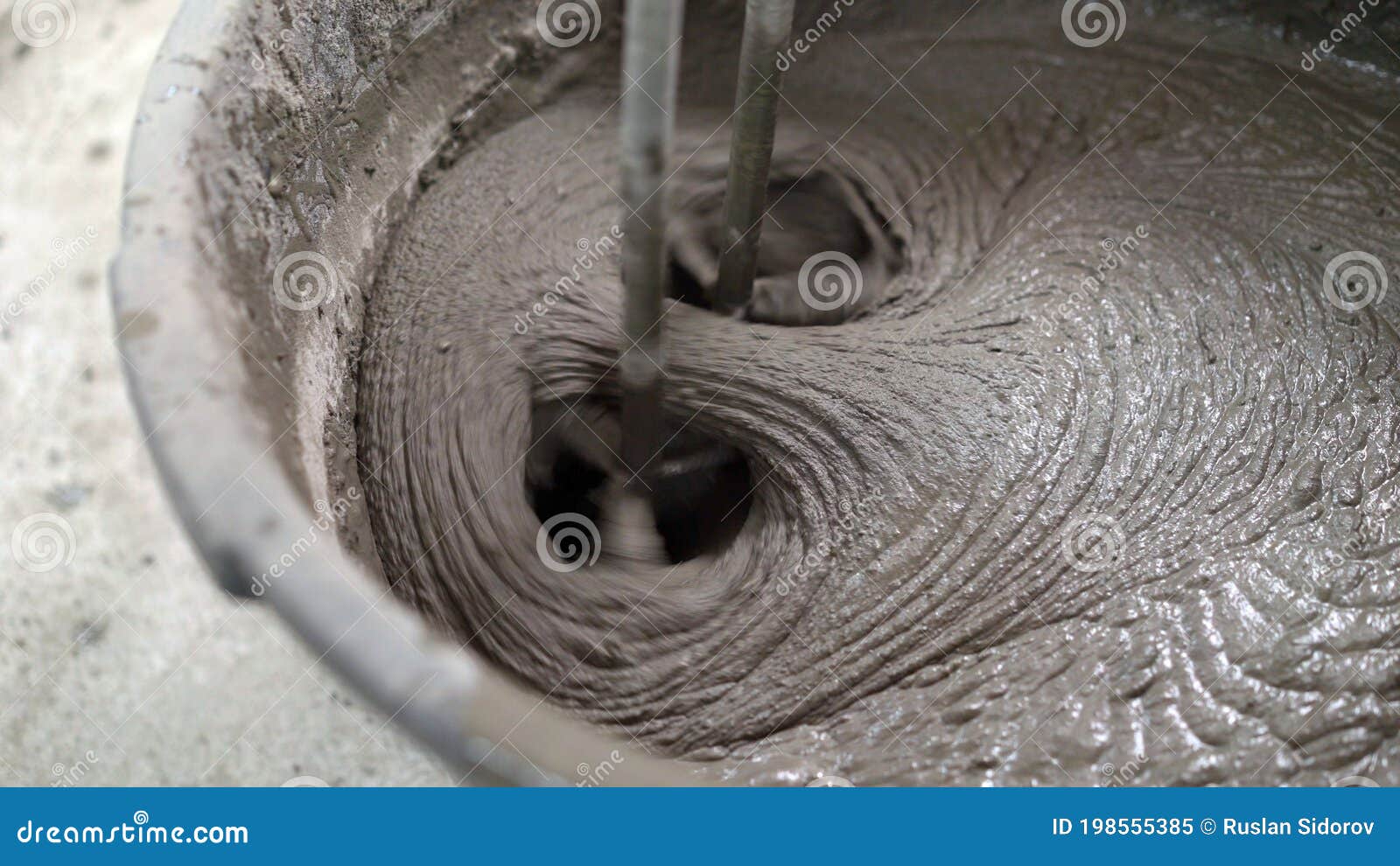 The Solution in the Bucket is Mixed Using a Construction Mixer. Mixing ...