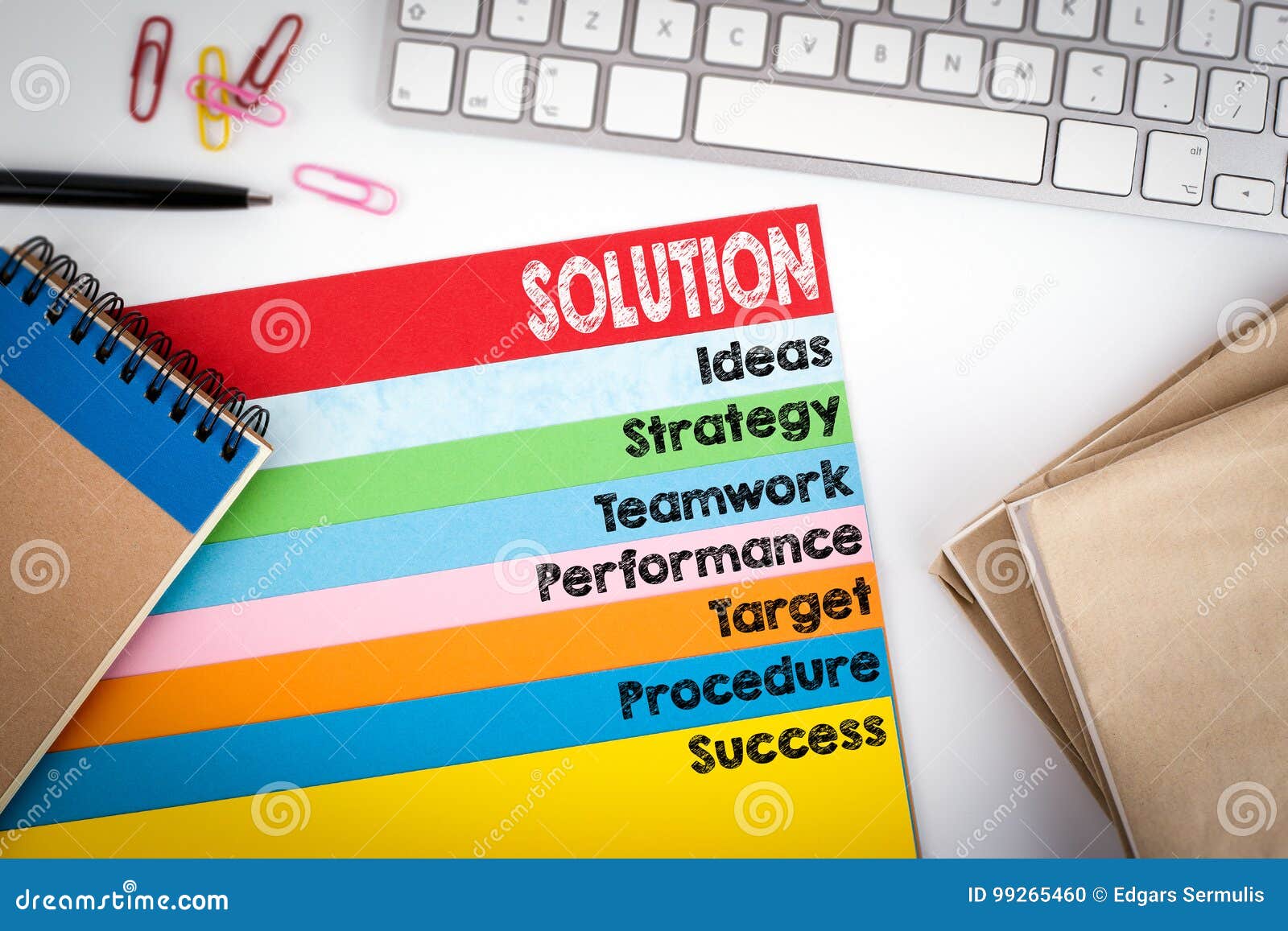 Solution Concept. Office Desk with a Computer Keyboard and Color Pages ...