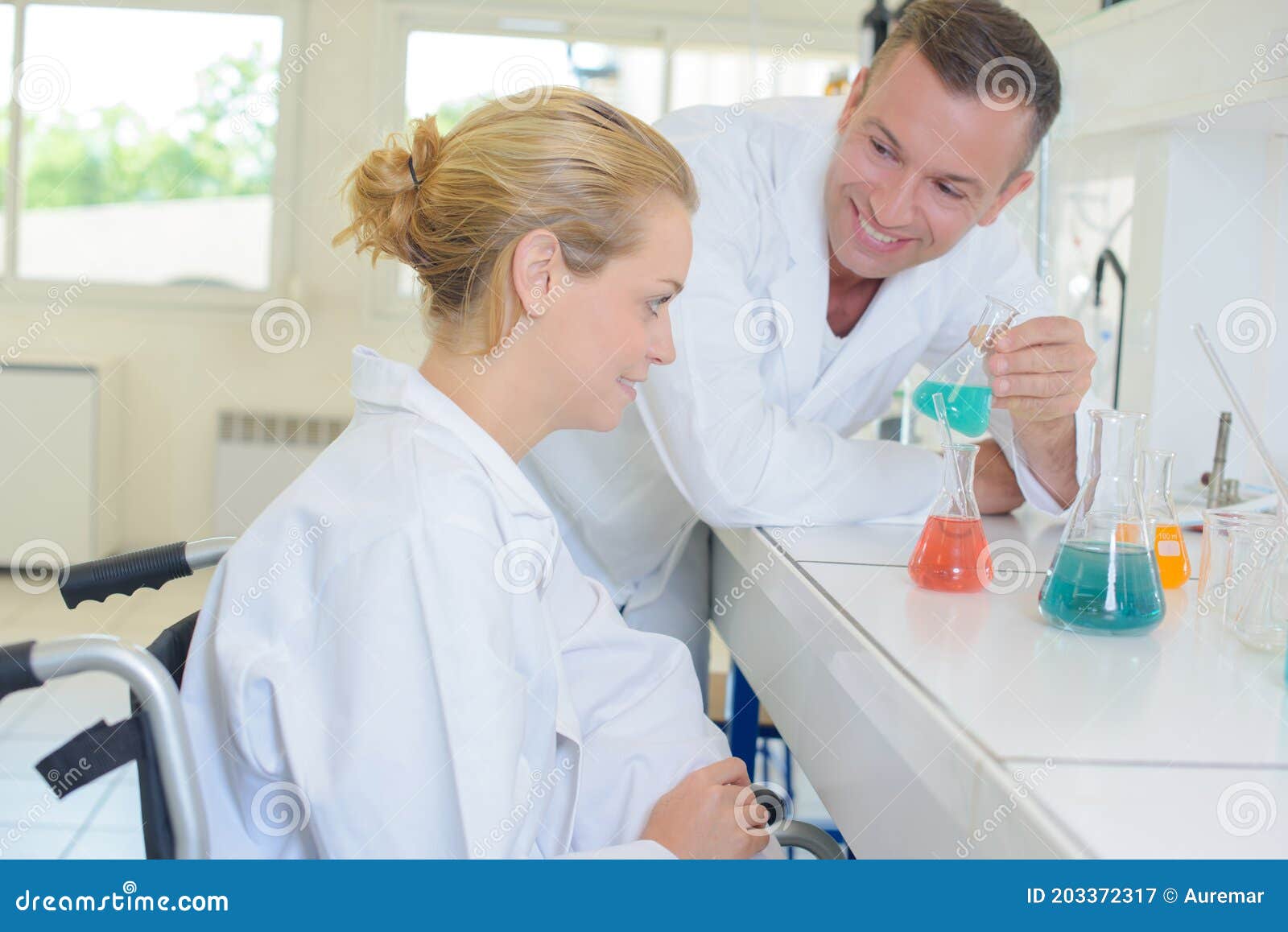 Solutions in Lab with Handicapped Employee Stock Image - Image of ...