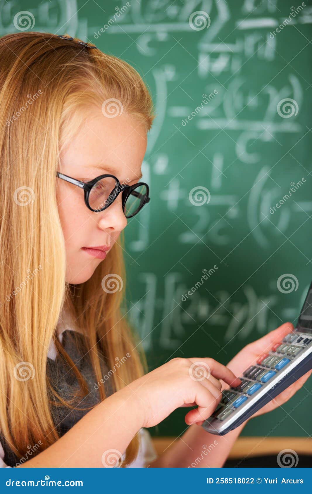 Solving Complex Math Problems. a Cute Blonde Girl Using Her Calculator ...