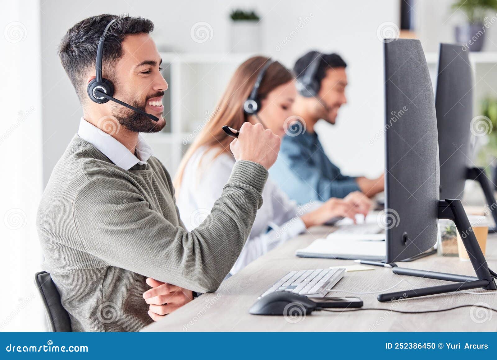 Solving Problems One Call at a Time. a Handsome Young Male Call Center ...
