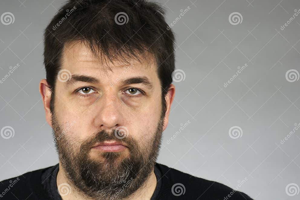 Somber Bearded Man Over Grey Stock Photo - Image of male, unhappy: 22276734
