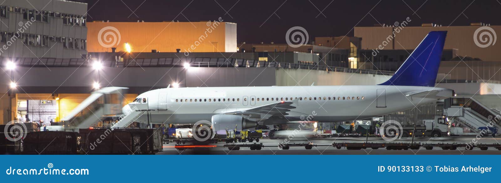 Some Airplanes Boarding at an Airport at Night Stock Image - Image of ...