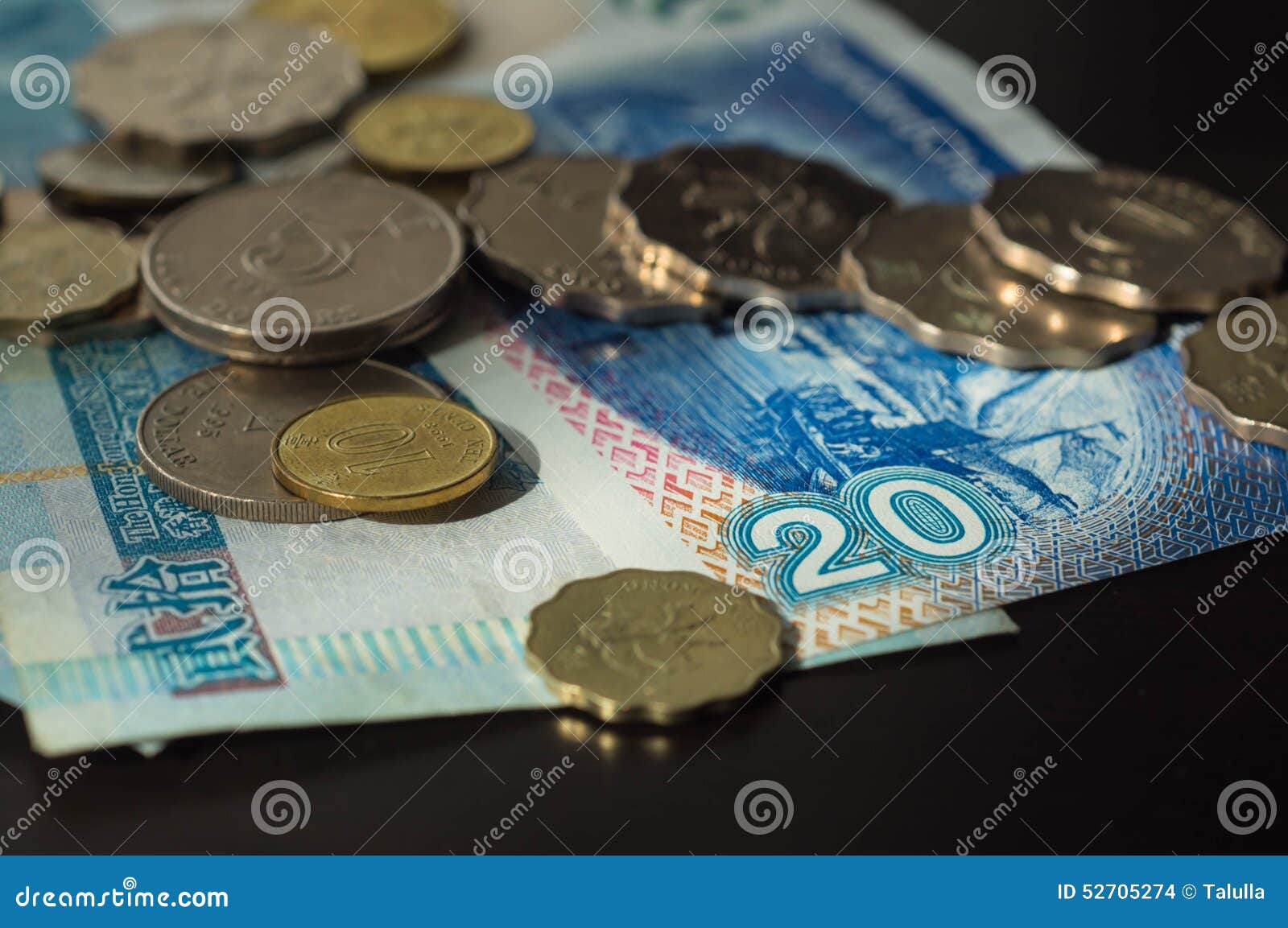 Some Coins and Notes Against a Dark Background Stock Photo - Image of ...