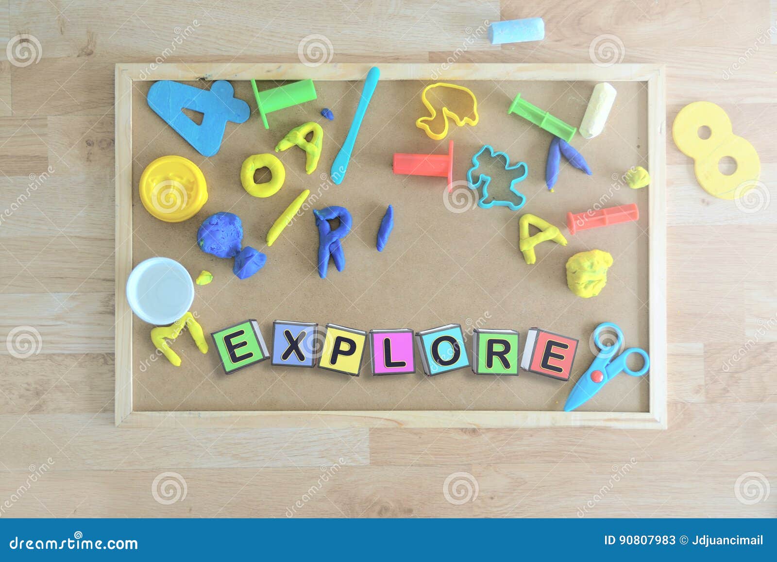 Some Colored Cube Letters on a Blackboard in a Classroom Forming the ...