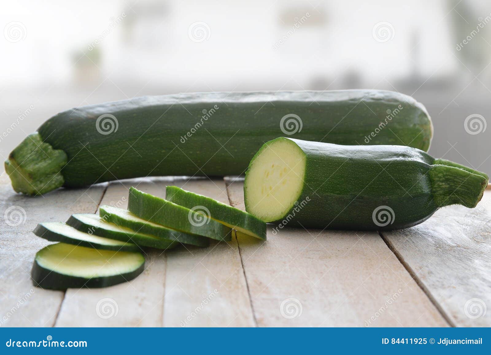 Some Courgette Sliced on a White Wooden Table in a Rusic Kitchen. Stock ...