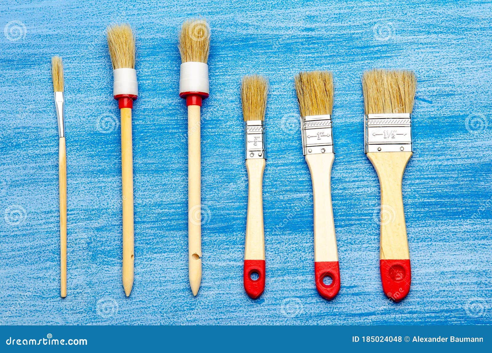 Some Different Brushes on a Light Blue Background Stock Photo - Image ...