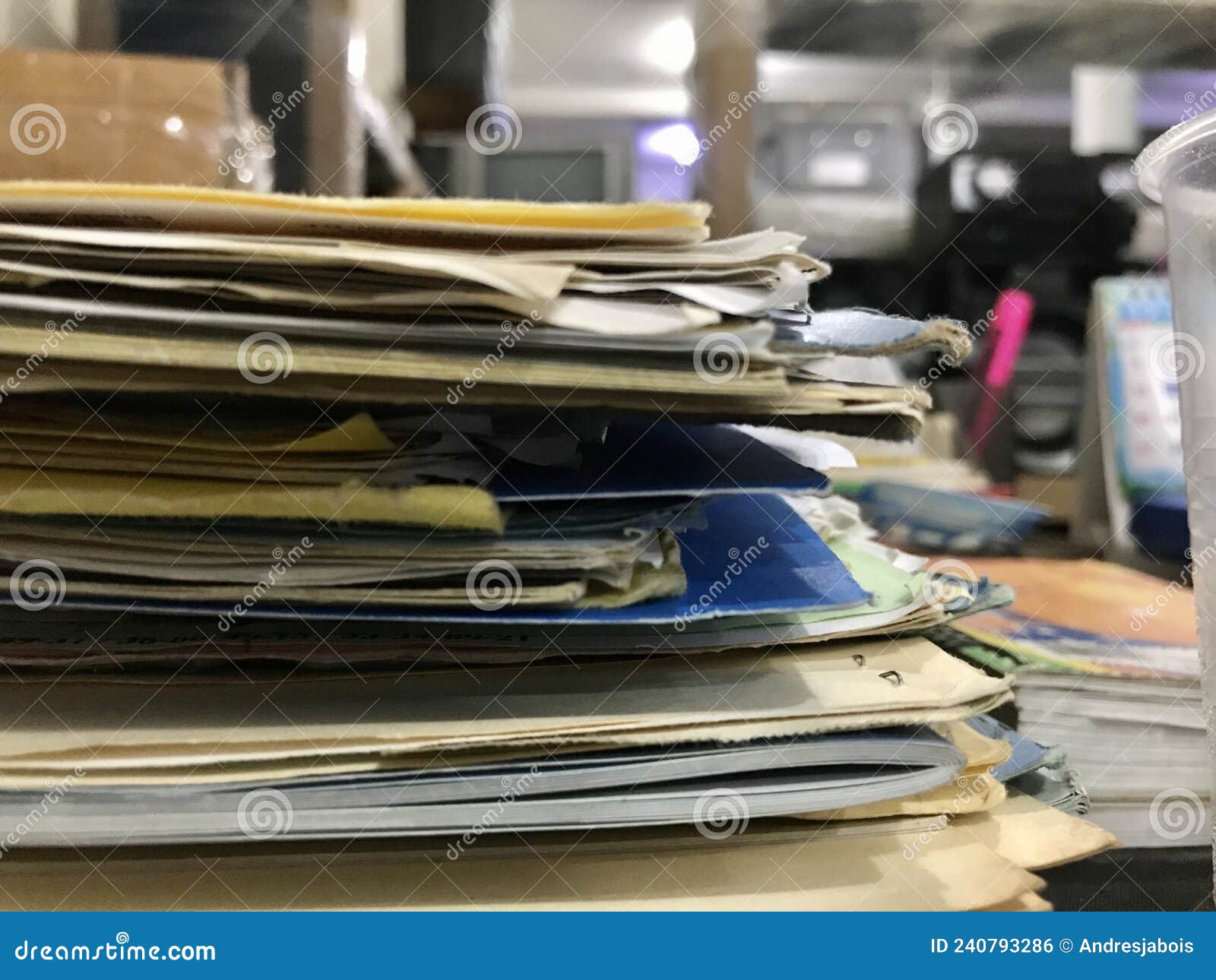 Some File Folders Stacked on Top of a Desk Stock Photo - Image of ...