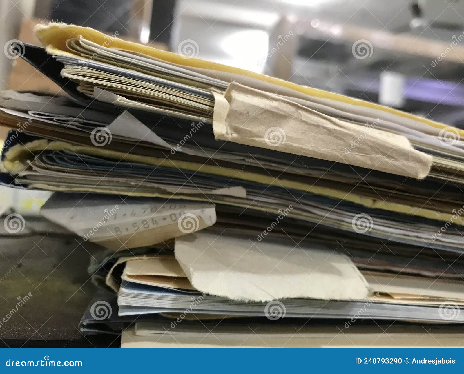 Some File Folders Stacked on Top of a Desk Stock Photo - Image of ...