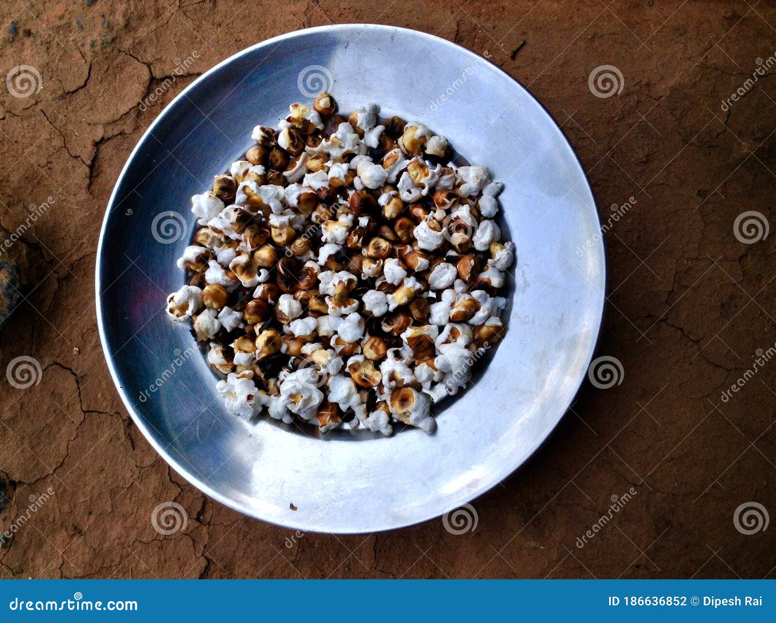 Some Fried Maize and Soyabin in the Middle of Silver Plate Stock Photo ...