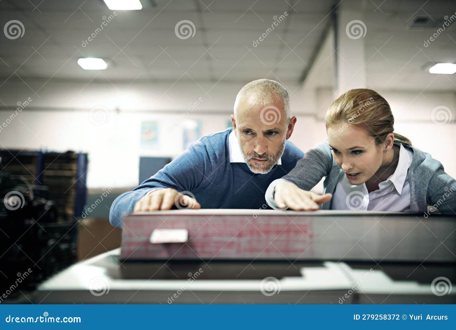 This is Some Good Work. Two Managers Looking Over Samples while ...