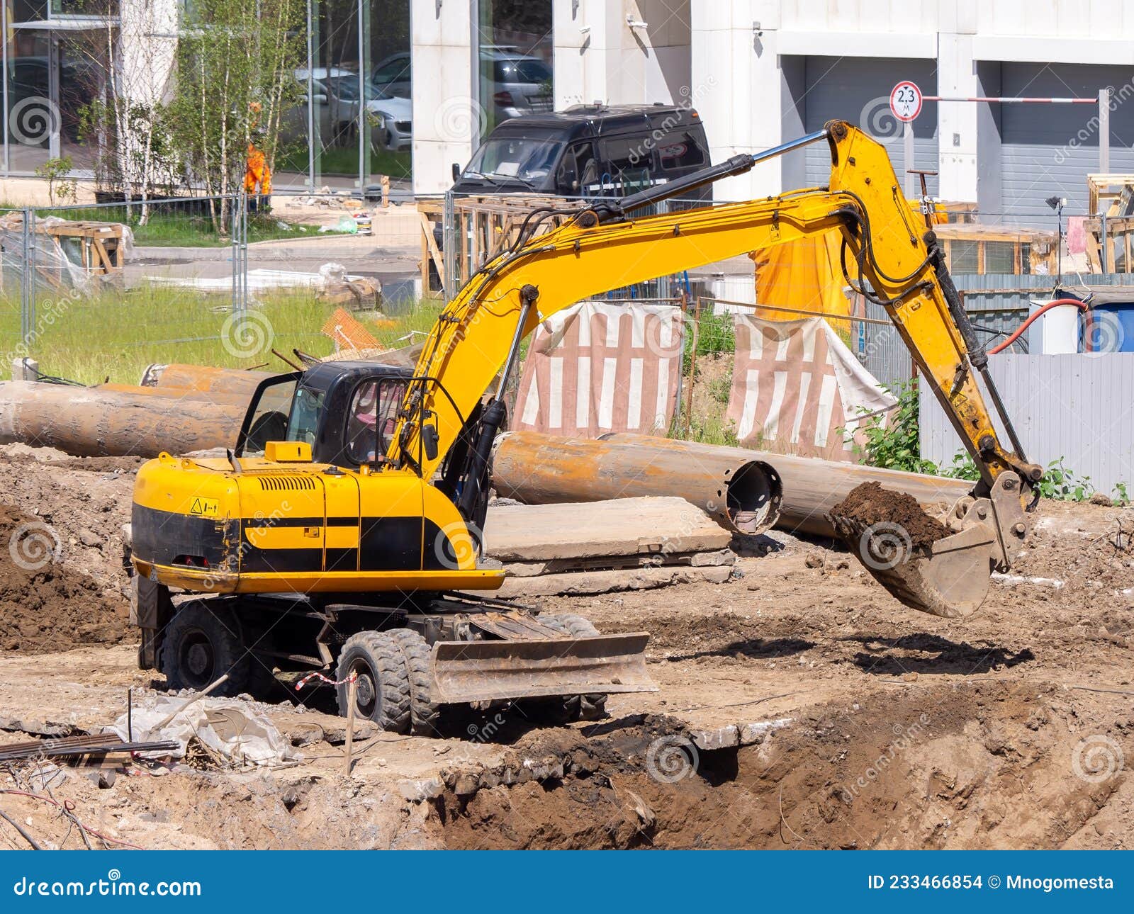 Some Kind of Wheeled Excavator is Digging a Foundation Pit. Excavation ...