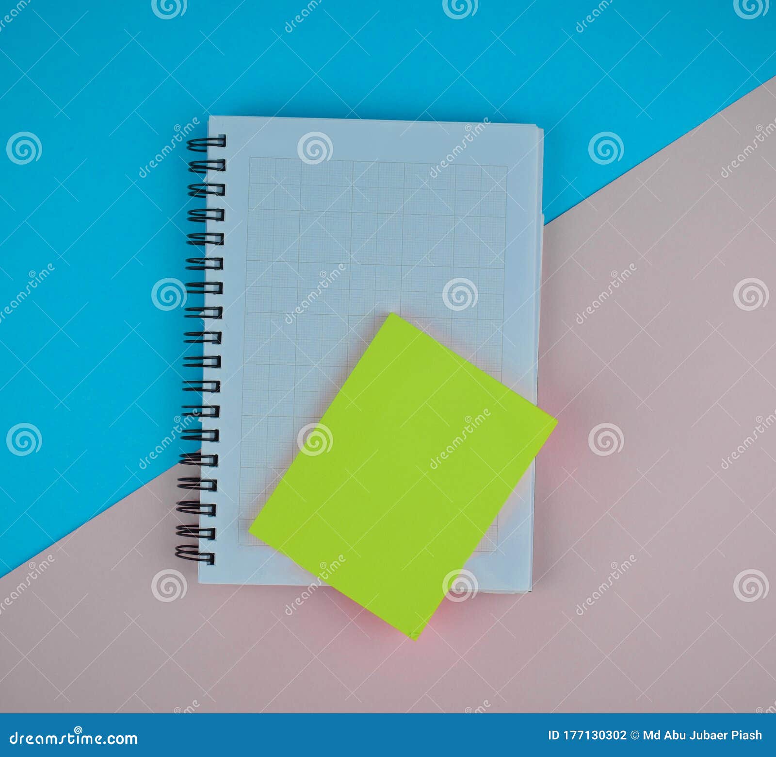 Some Light Green Sticky Notes on Top of a White Paper Diary before a ...